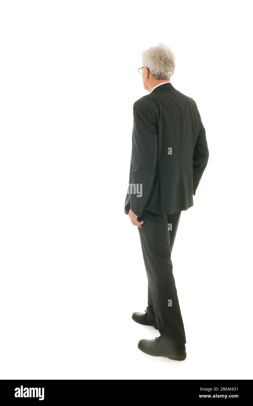 Senior business man walking away Stock Photo - Alamy