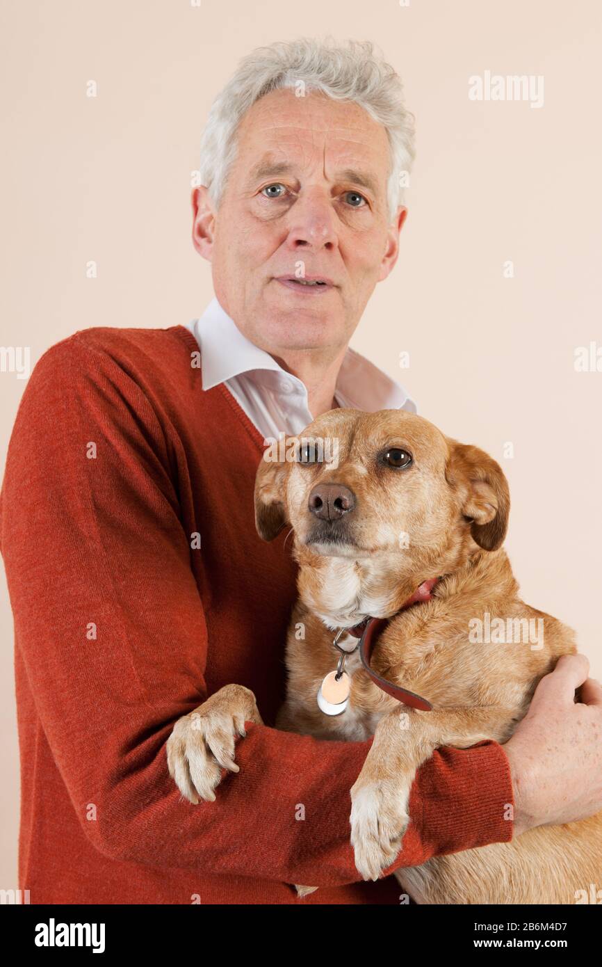 Portrait elder man with his dog Stock Photo - Alamy