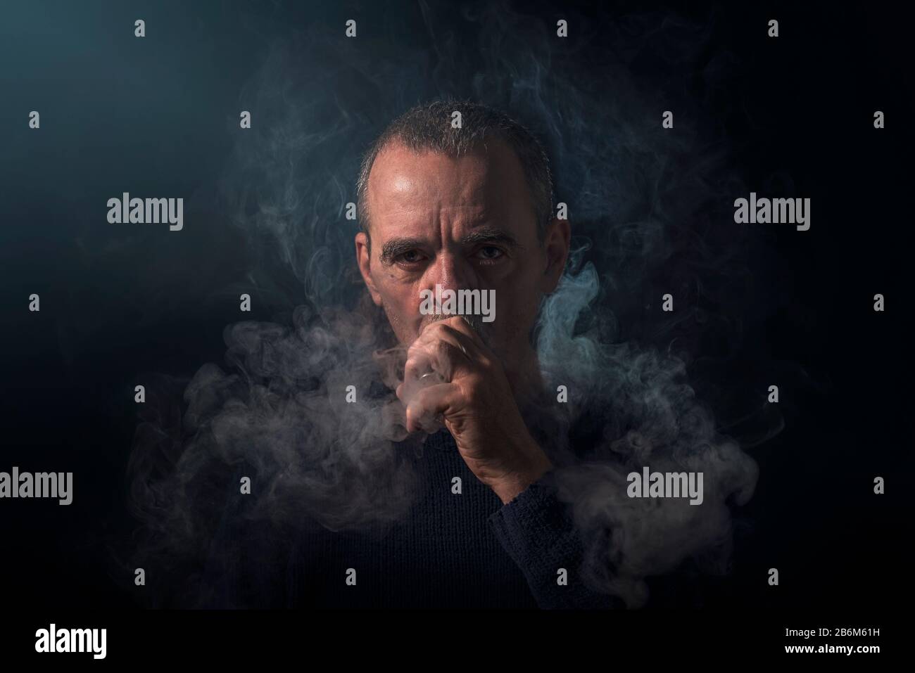 portrait of a man with vaporizer and smoke Stock Photo - Alamy