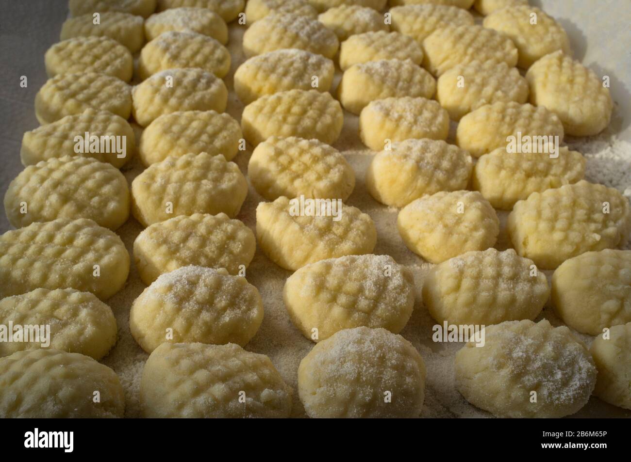 uncooked homemade Italian potato gnocchi with flour Stock Photo - Alamy