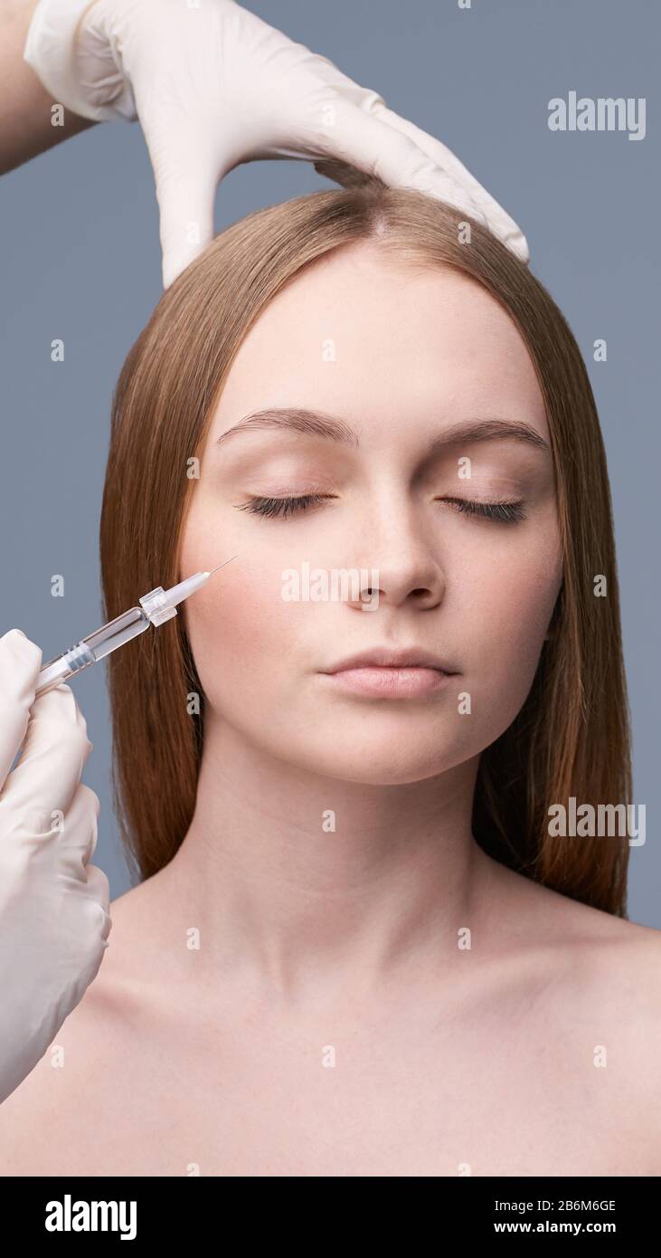 Young pretty woman studio portrait. Cosmetology injection concept Stock ...