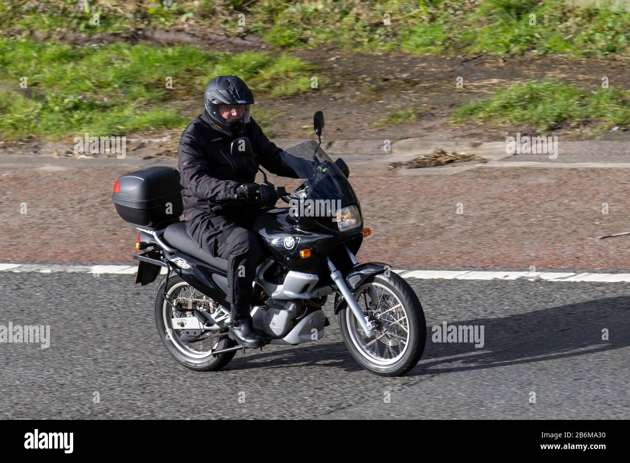 BMW motorcycle rider; Vehicular traffic, two wheeled transport, modern ...