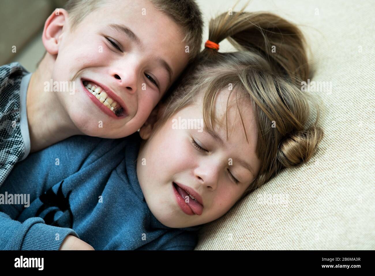 Two children boy and girl fooling around having fun together. Happy ...