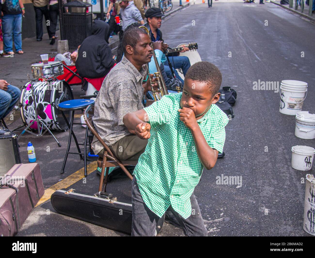 Child Playing Air Trombone with Buskers on Royal Street in the French ...