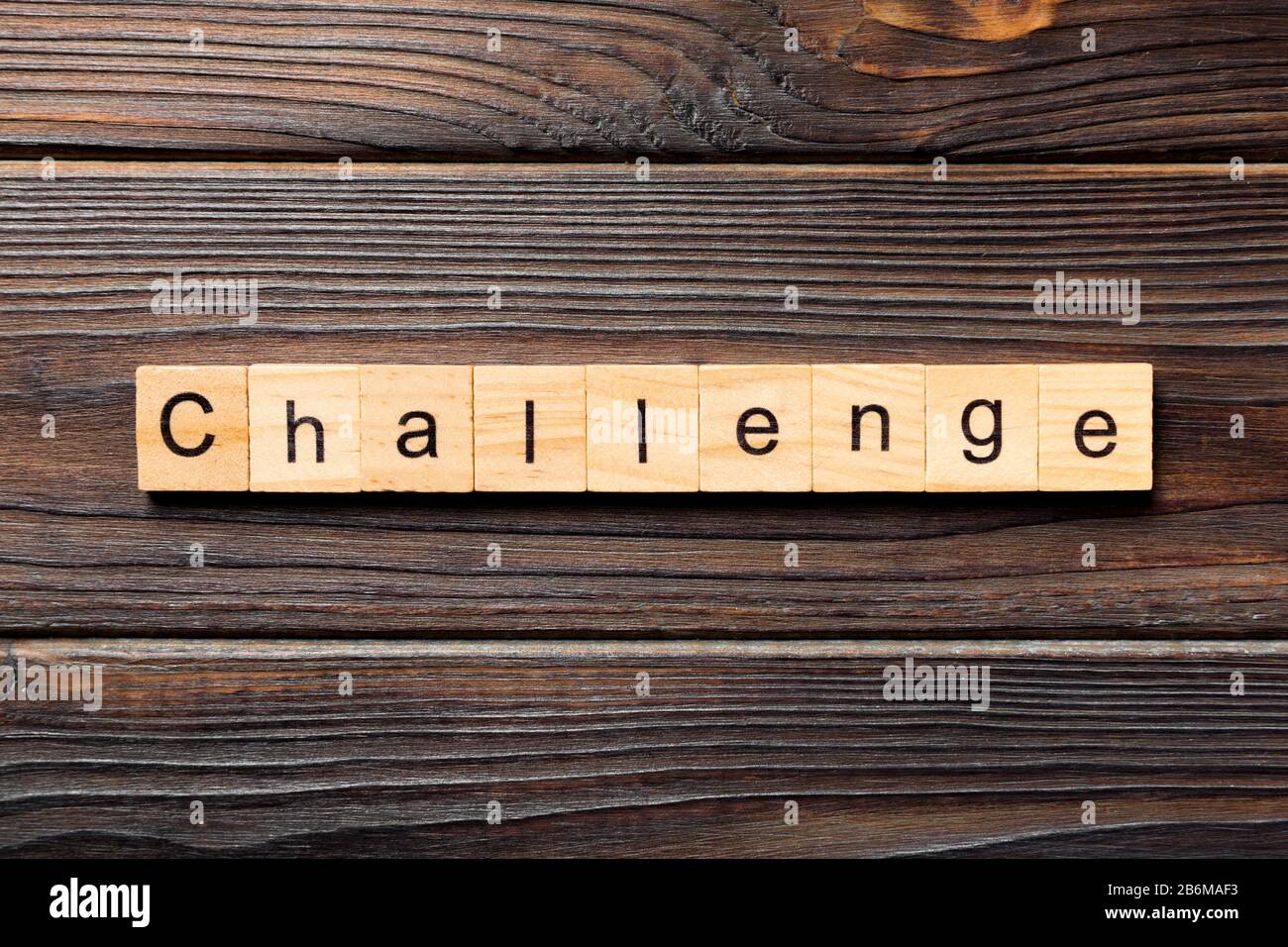 CHALLENGE word written on wood block. CHALLENGE text on wooden table ...