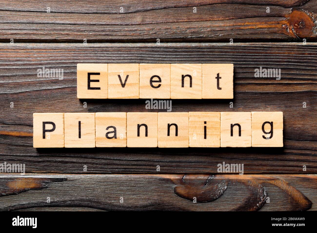 EVENT PLANNER word written on wood block. EVENT PLANNER text on wooden ...
