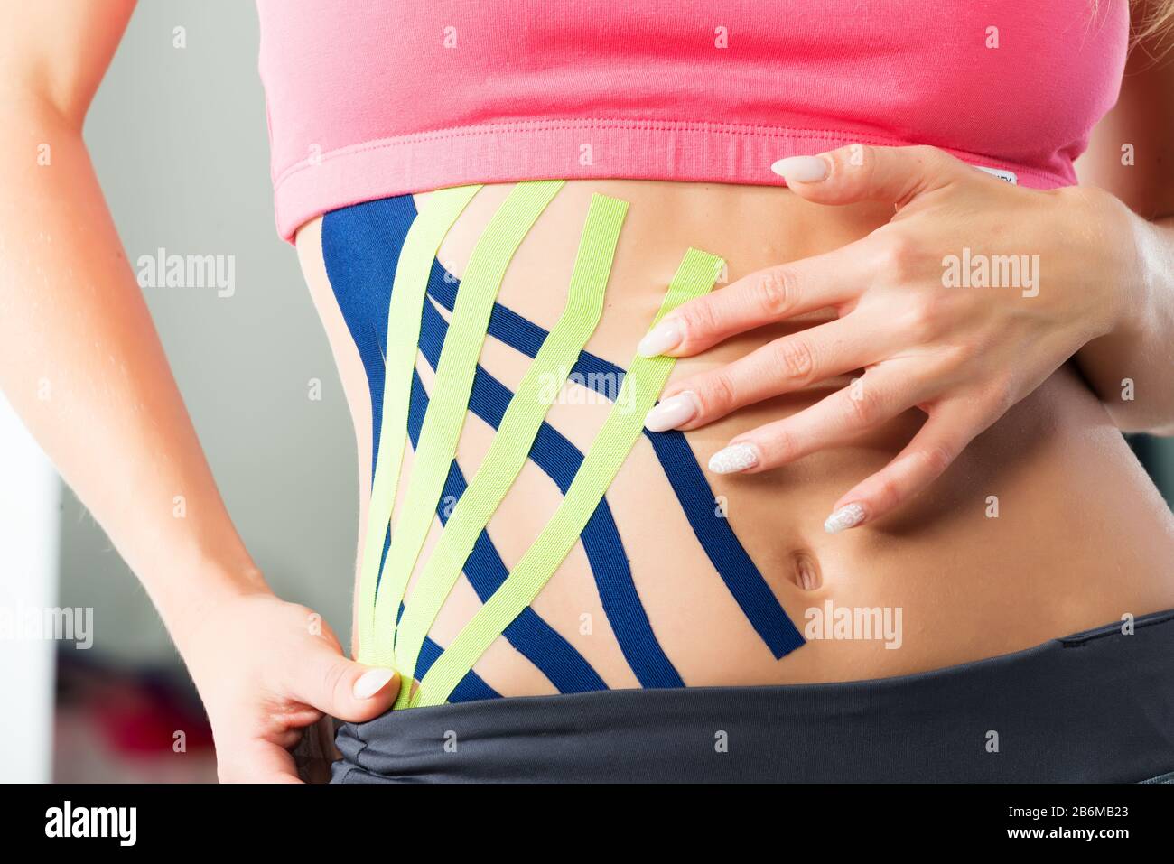 Bright medical tape on the abdomen of a girl Stock Photo - Alamy