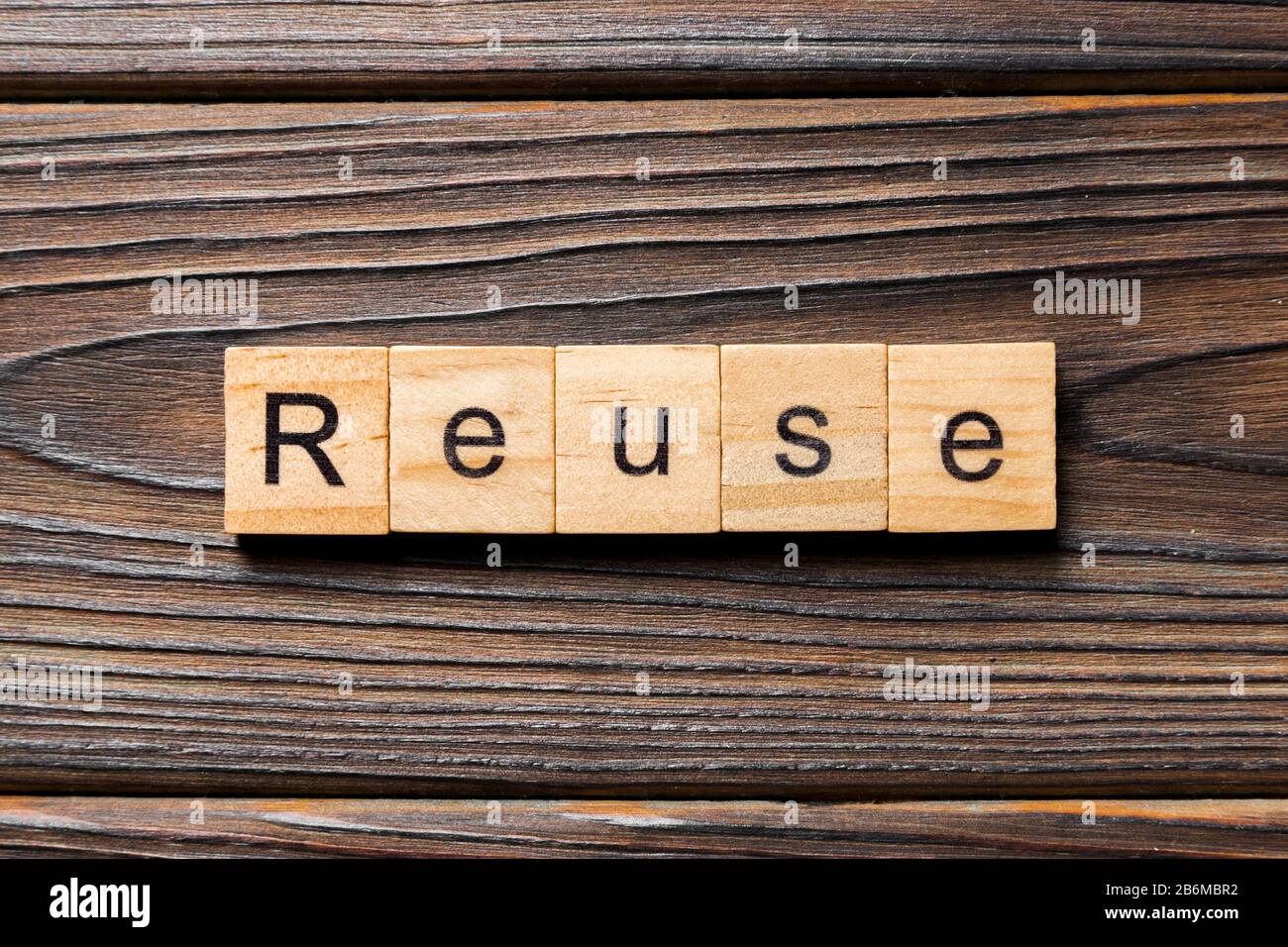 reuse word written on wood block. reuse text on wooden table for your ...