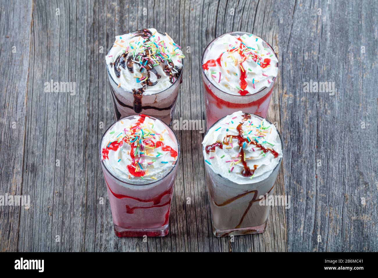 Four glasses of colorful milkshake cocktails - Chocolate Milkshake ...