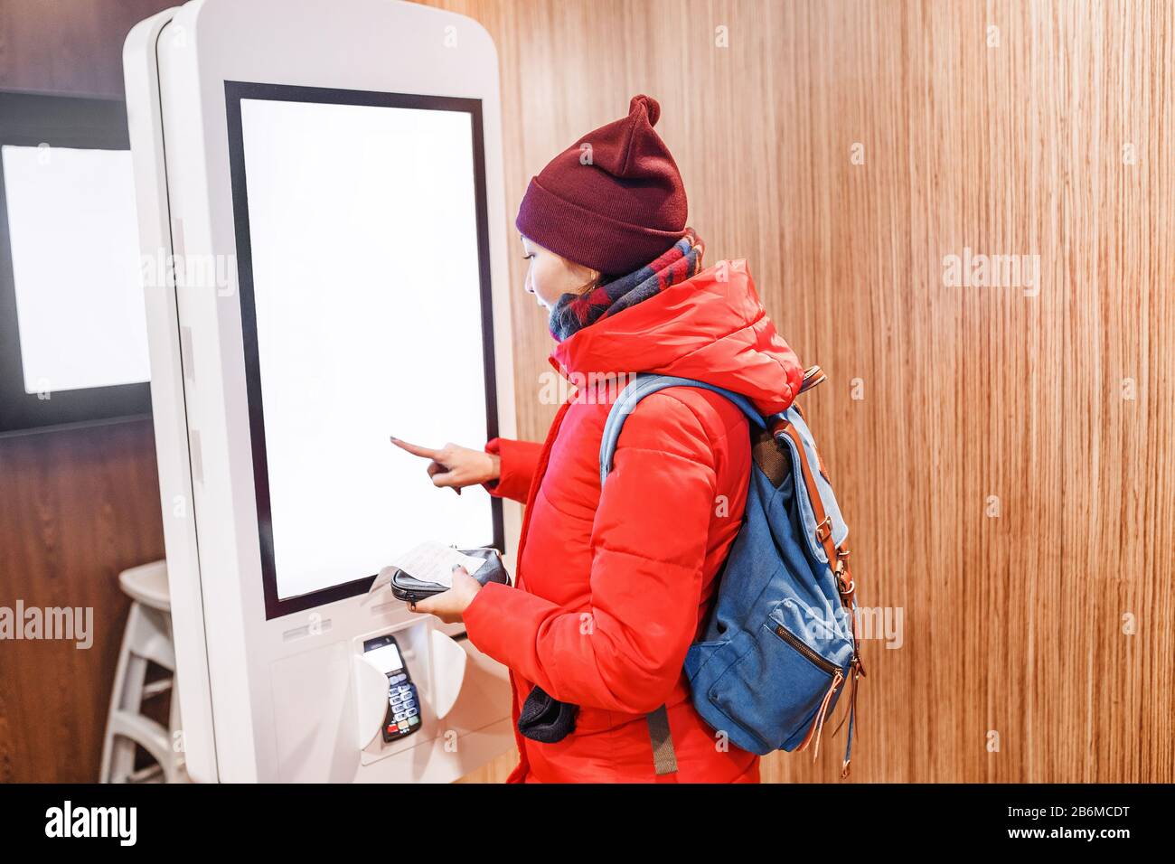 A woman at the touch screen payment terminal Stock Photo - Alamy
