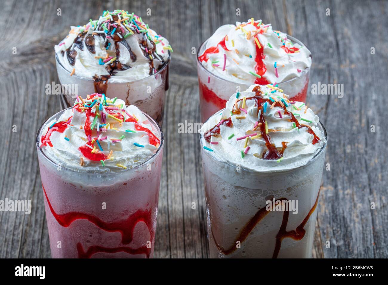 Four glasses of colorful milkshake cocktails - Chocolate Milkshake ...