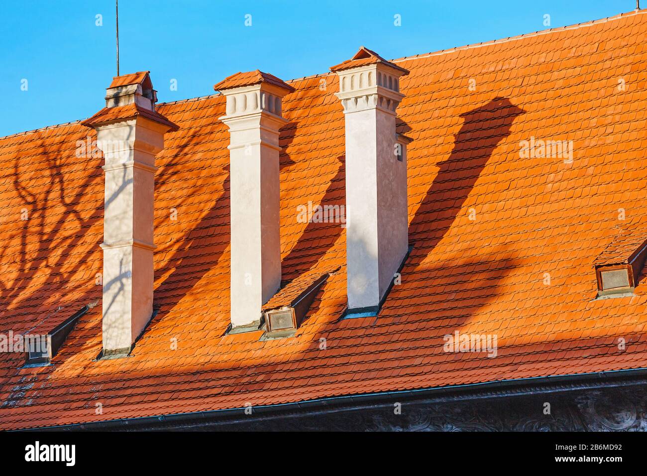 chimney pipes on top of red roof tiles Stock Photo - Alamy