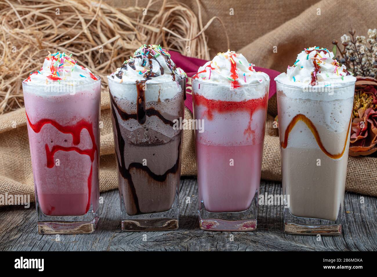 Four glasses of colorful milkshake cocktails - Chocolate Milkshake ...