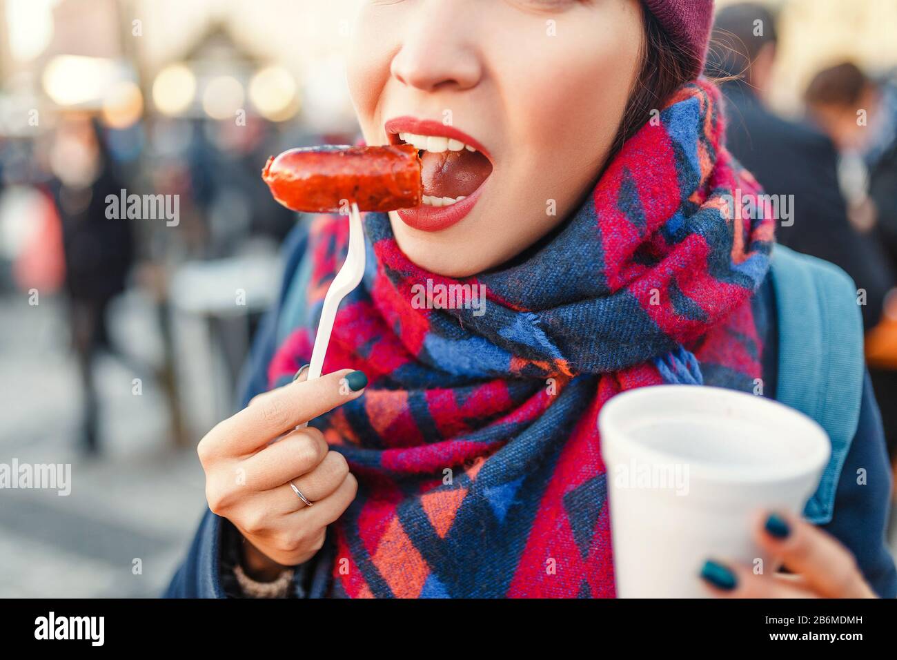 Woman eating sausage hi-res stock photography and images - Alamy