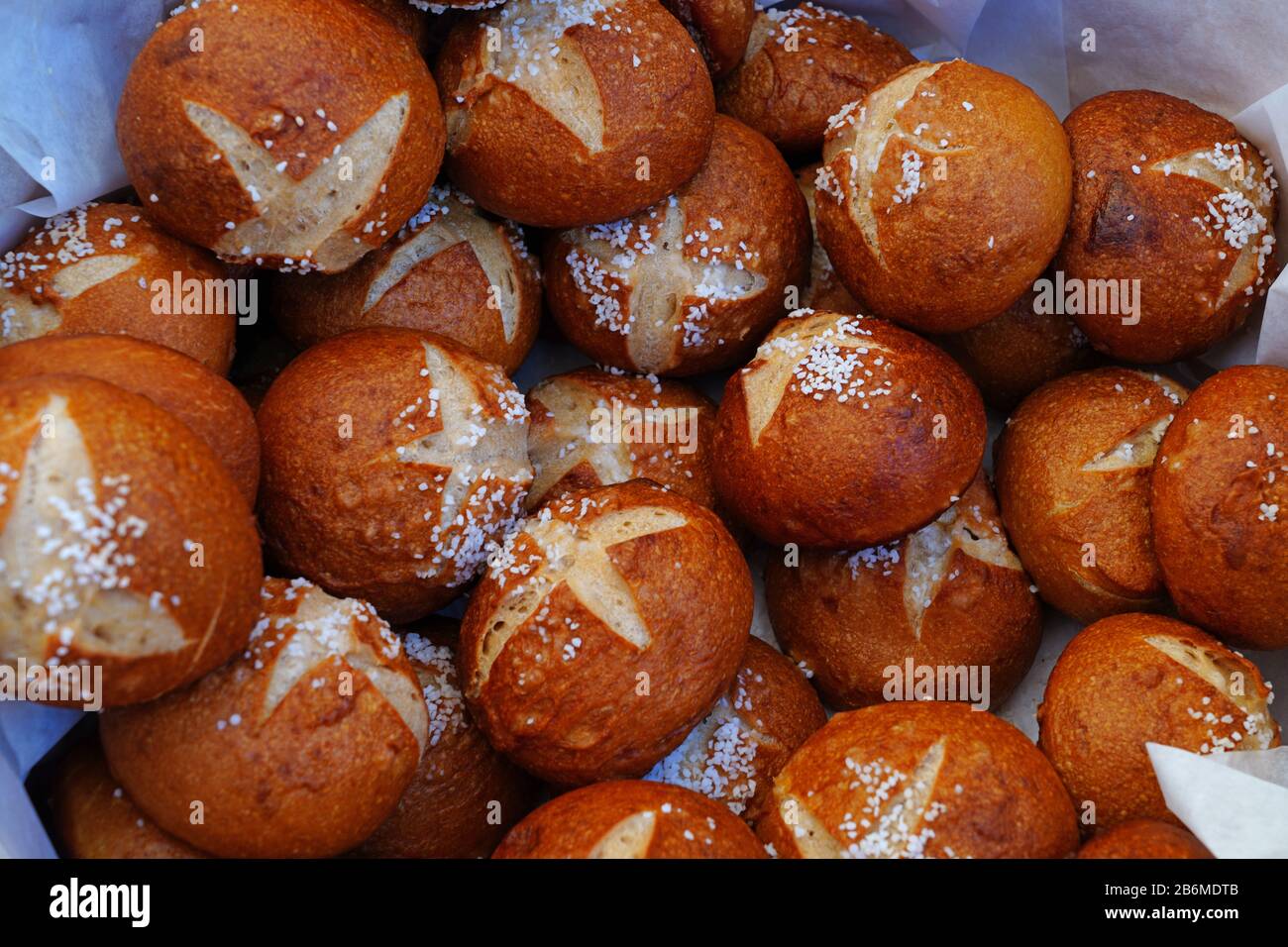 Pretzel bread rolls with salt Stock Photo - Alamy