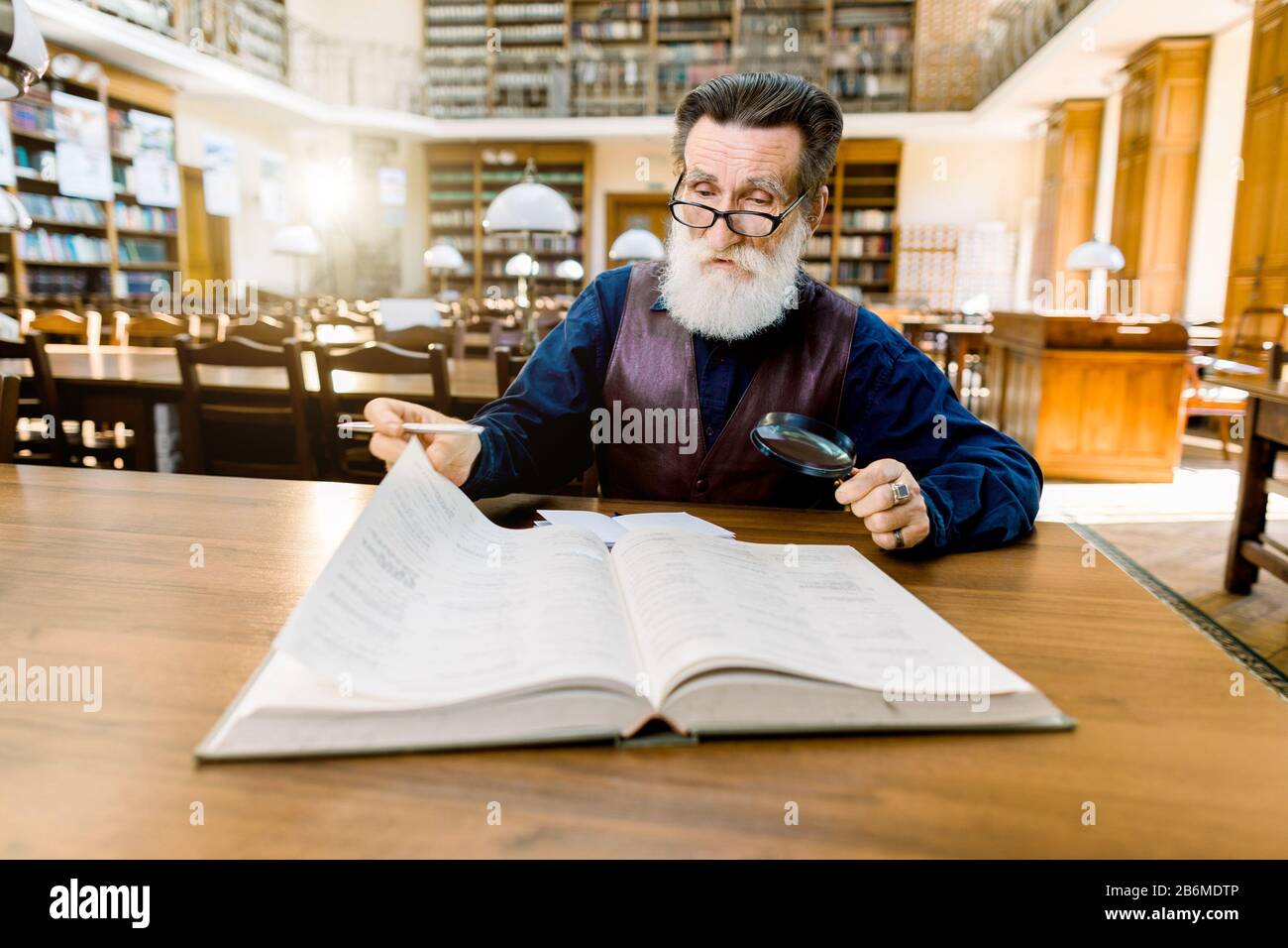 An old intelligent man teacher professor, in stylish casual vintage ...