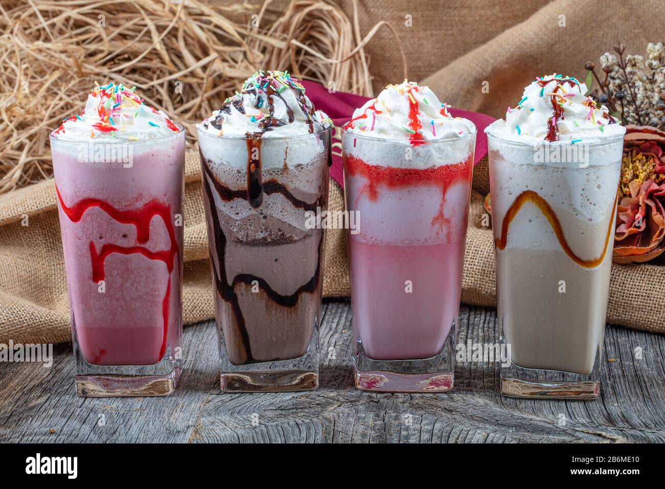 Four glasses of colorful milkshake cocktails - Chocolate Milkshake ...