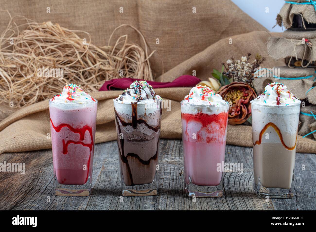 Four glasses of colorful milkshake cocktails - Chocolate Milkshake ...