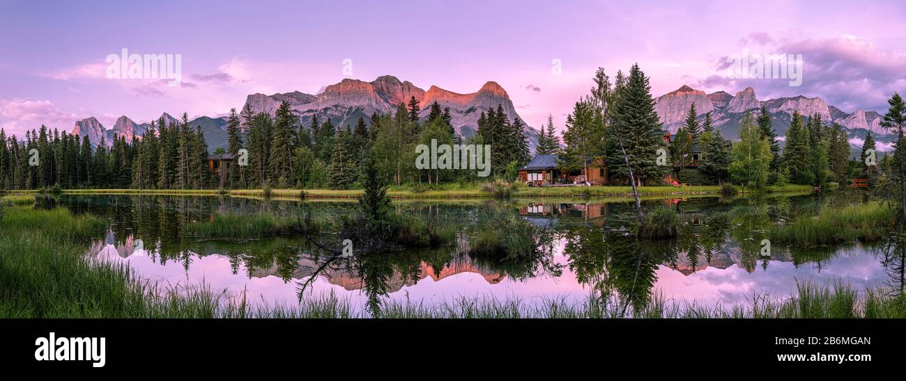 View of lake and mountains, Spring Creek Pond, Alberta, Canada Stock ...