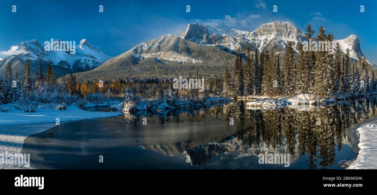 View of lake and mountains, Spring Creek Pond, Alberta, Canada Stock ...