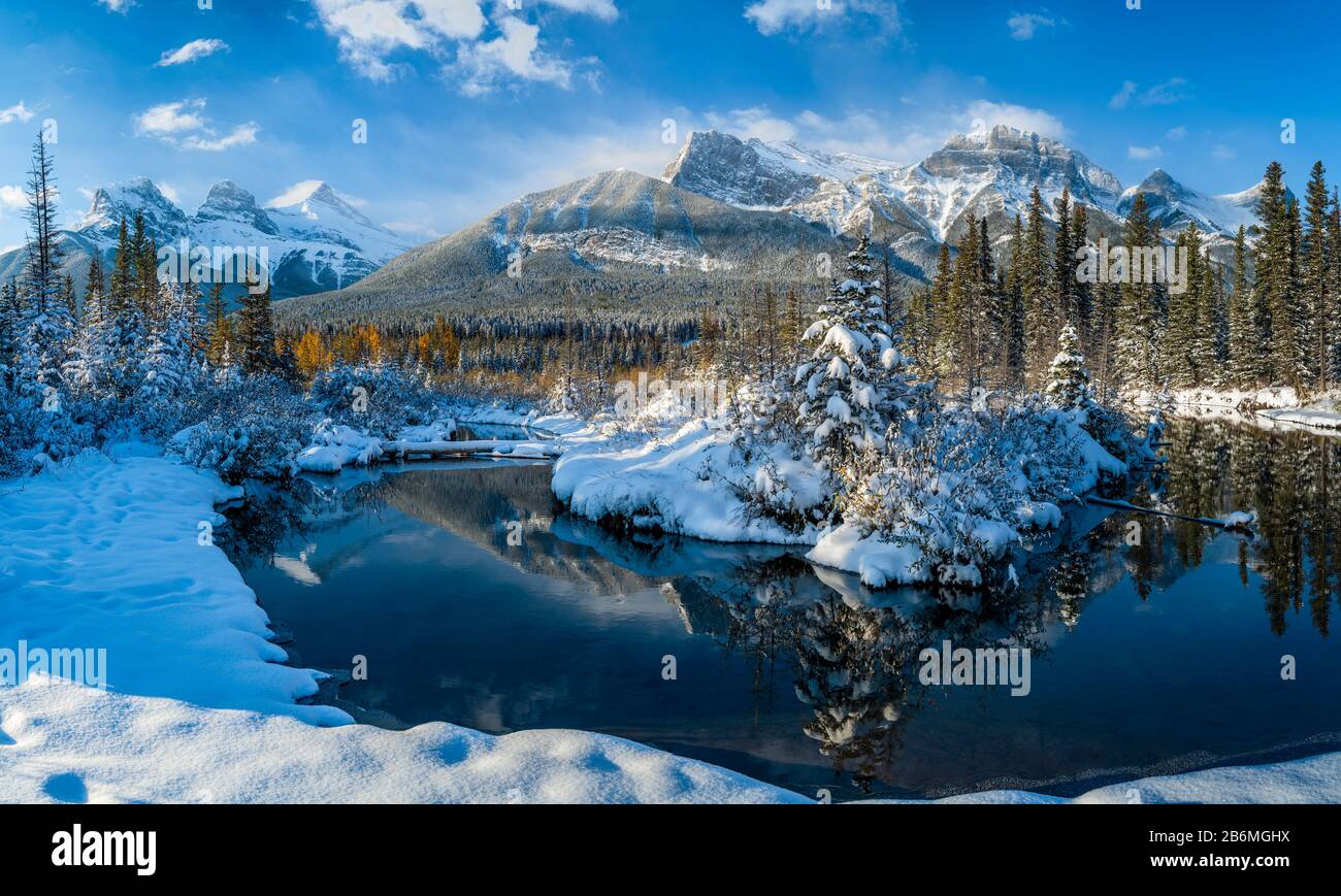 View of lake and mountains, Spring Creek Pond, Alberta, Canada Stock ...
