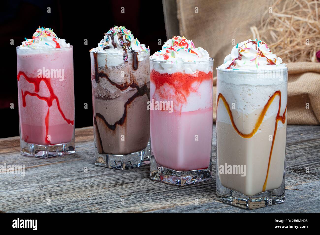Four glasses of colorful milkshake cocktails - Chocolate Milkshake ...