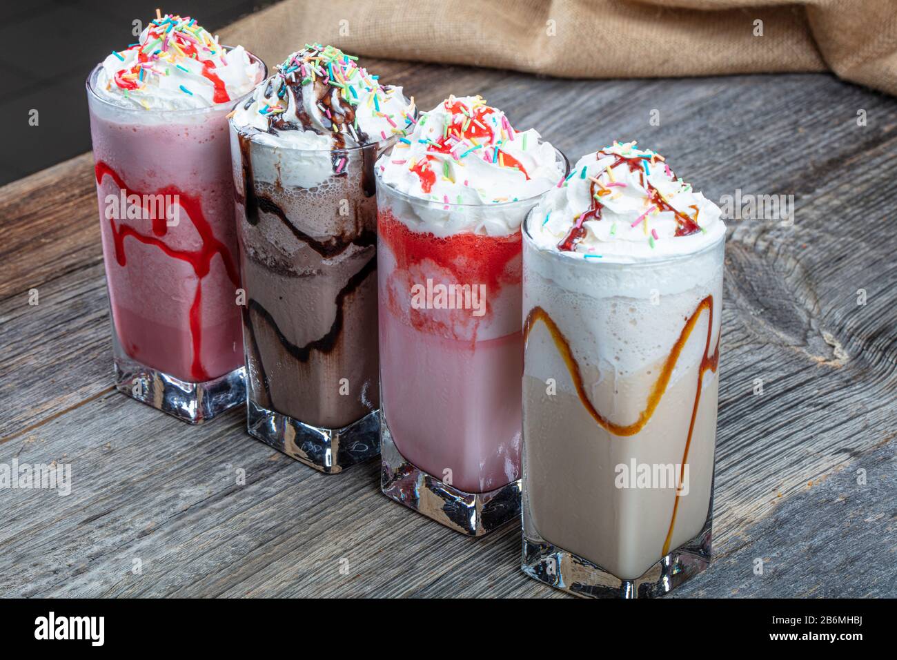 Four glasses of colorful milkshake cocktails - Chocolate Milkshake ...