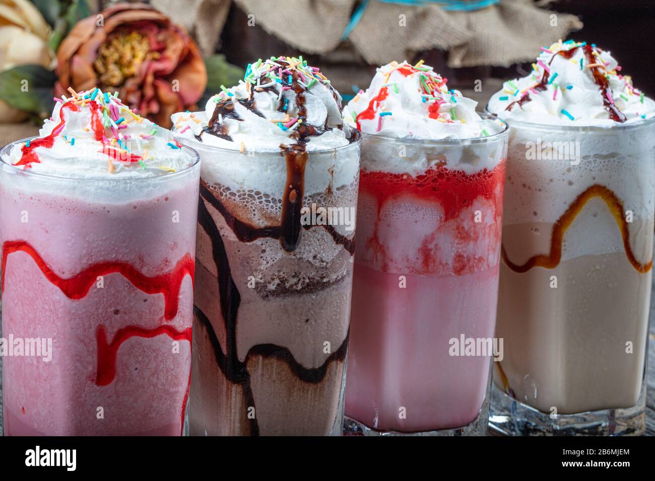 Four glasses of colorful milkshake cocktails - Chocolate Milkshake ...