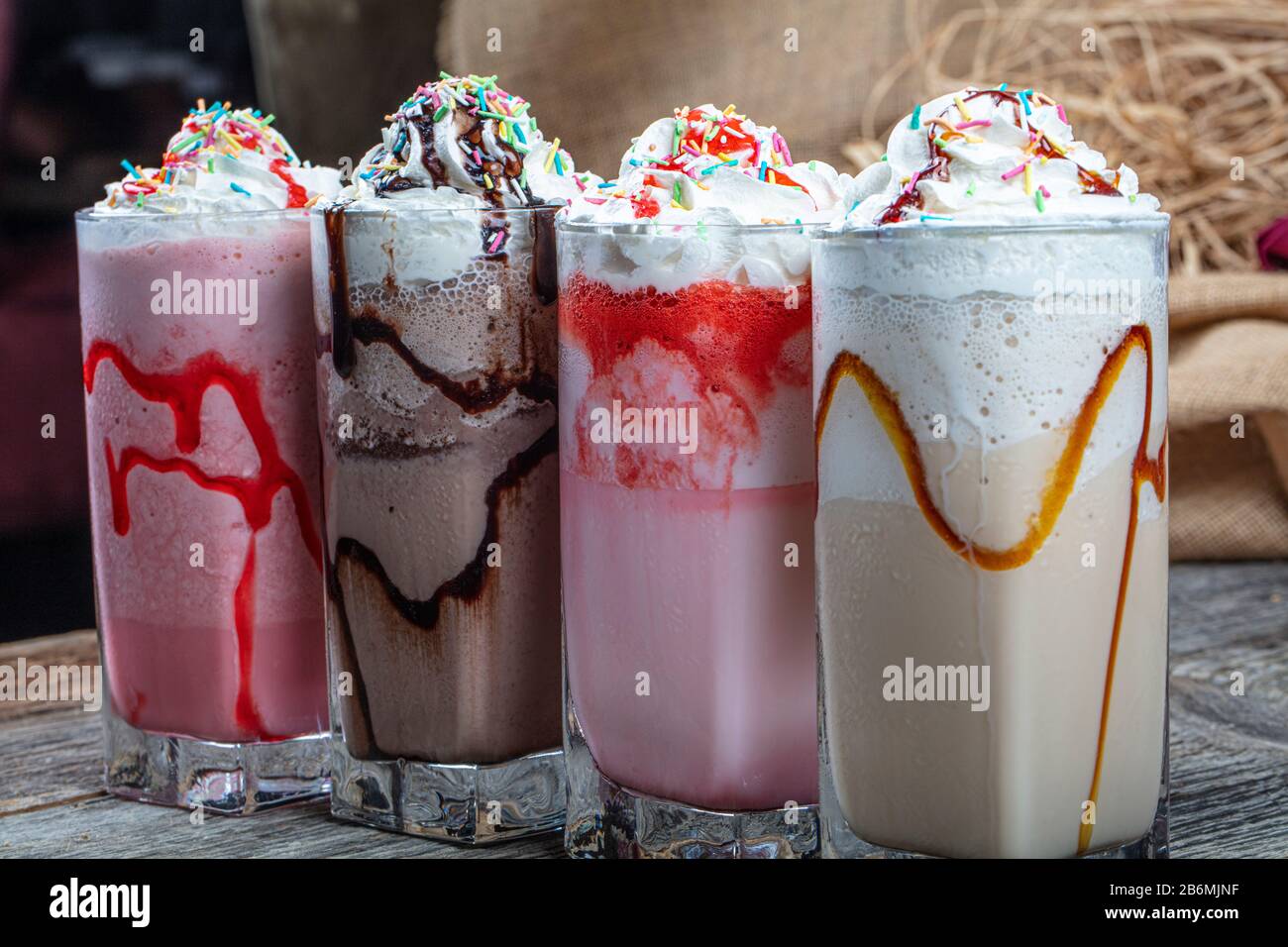 Four glasses of colorful milkshake cocktails - Chocolate Milkshake ...