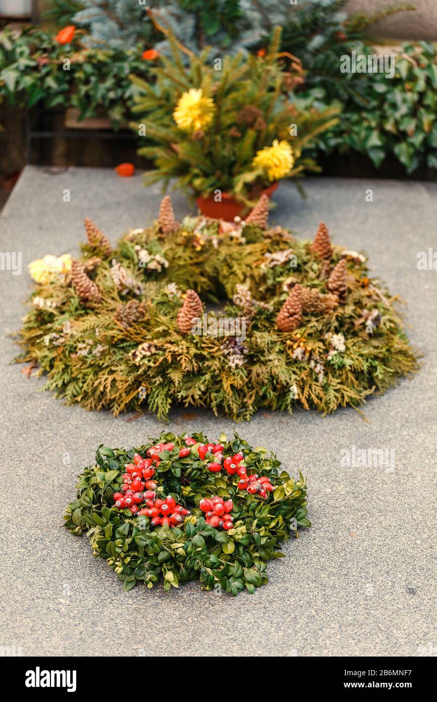 The gravestone with christmas funeral wreaths on the Vysehrad Cemetery ...