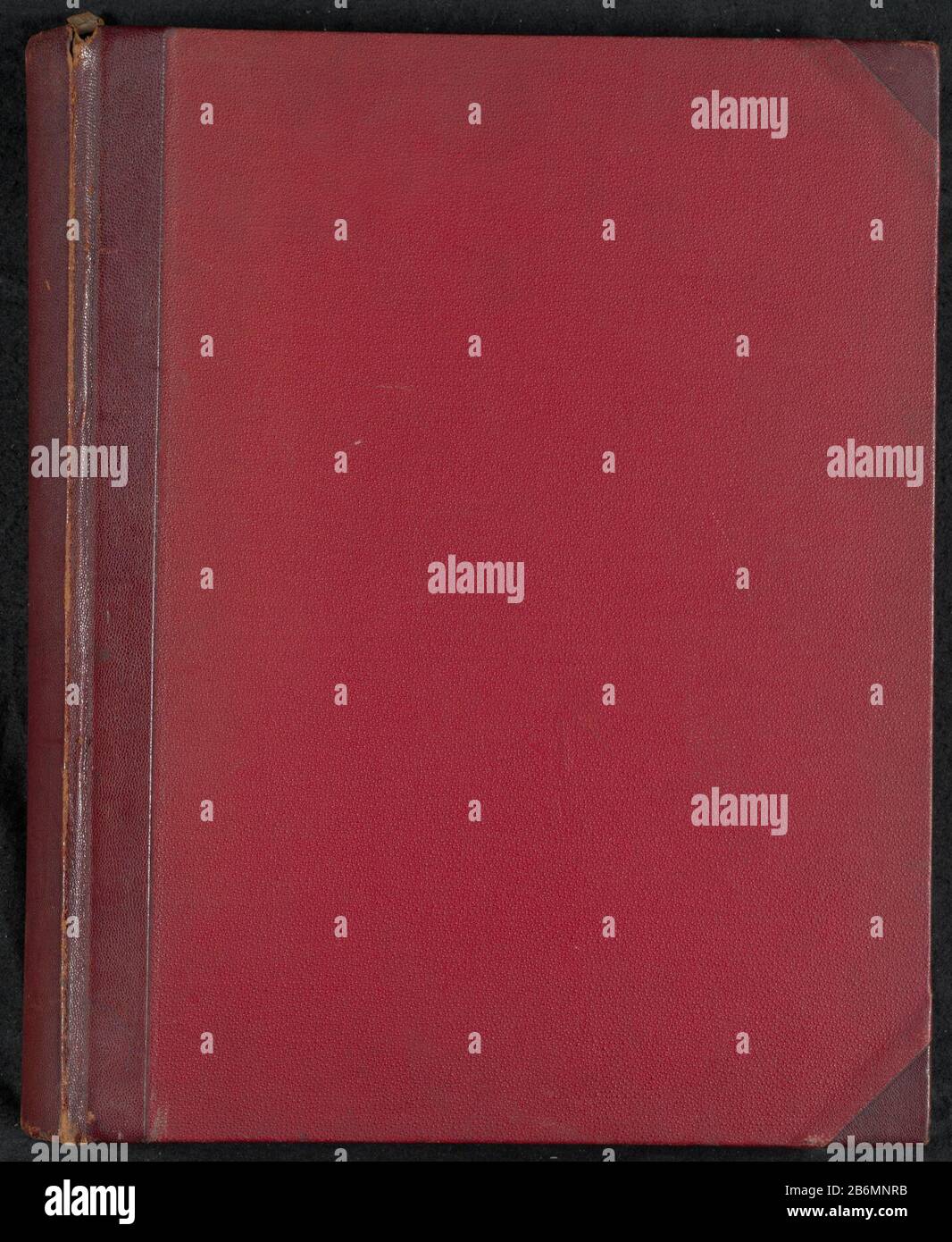 Photo album in red linen cover with leather spine and vertices ...