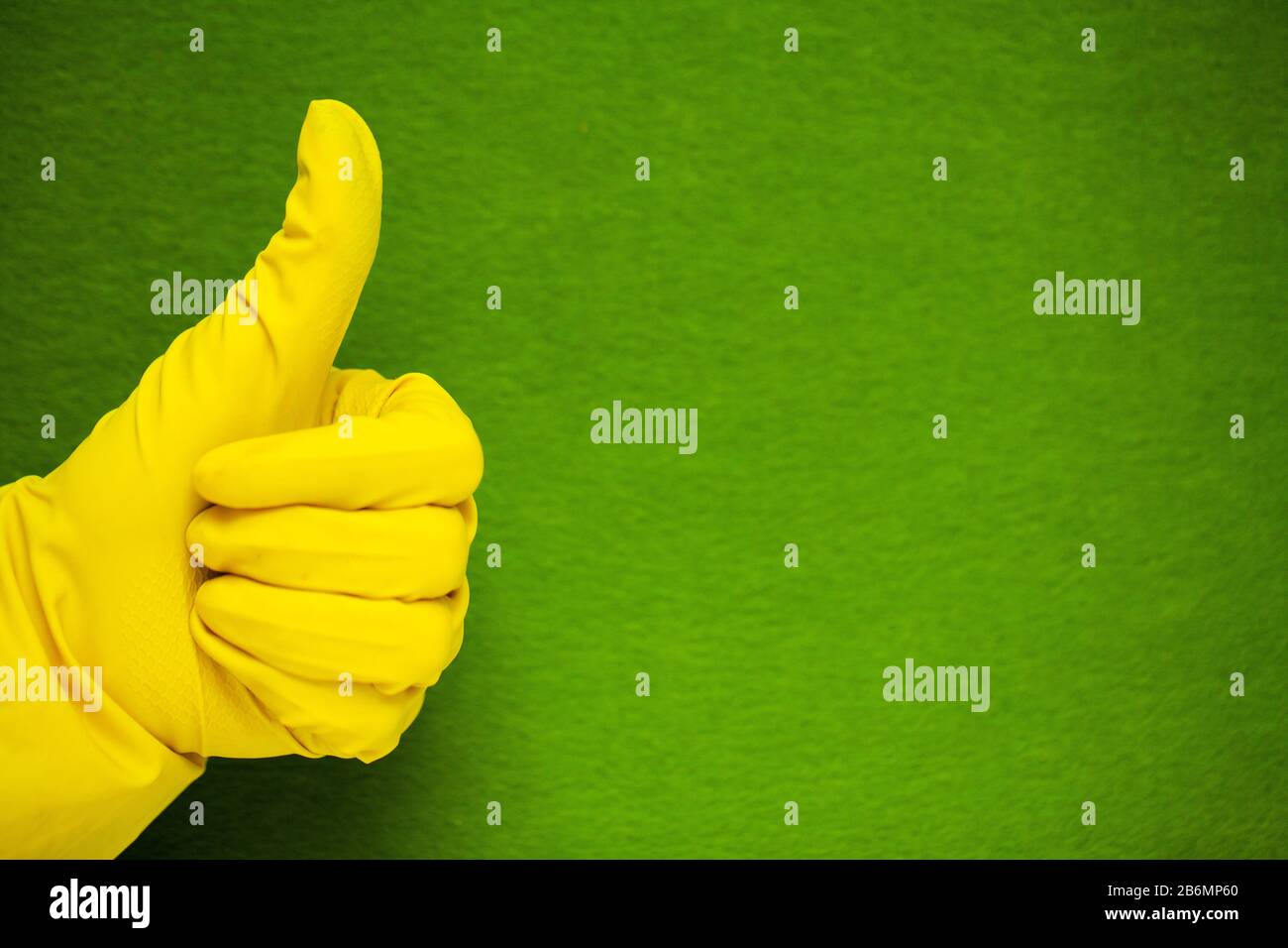 Product for professional cleaning on green background Stock Photo - Alamy