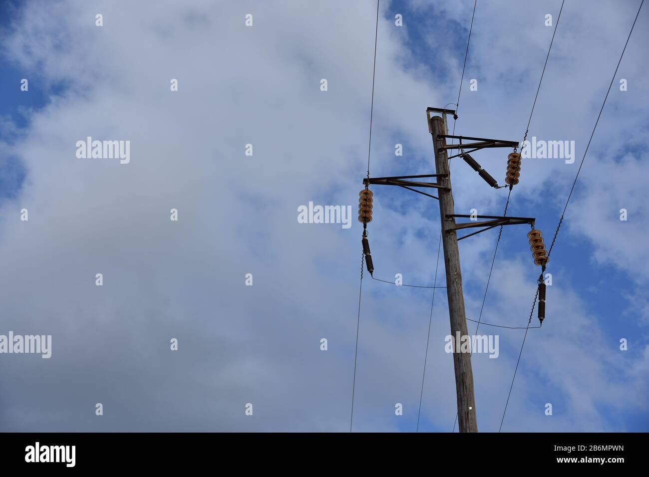 Power transmission network with clouds in the background Stock Photo ...