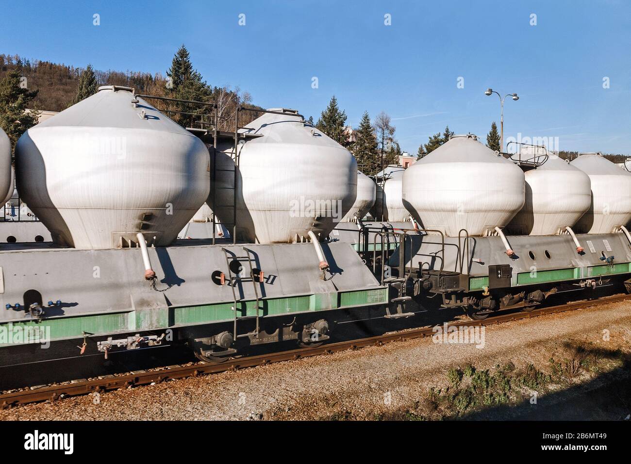 Freight train with cement containers Stock Photo - Alamy