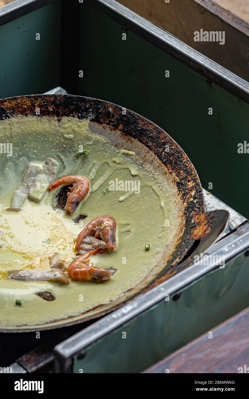 Vietnamese sizzling shrimp pancake at street food hawker- Banh Xeo ...