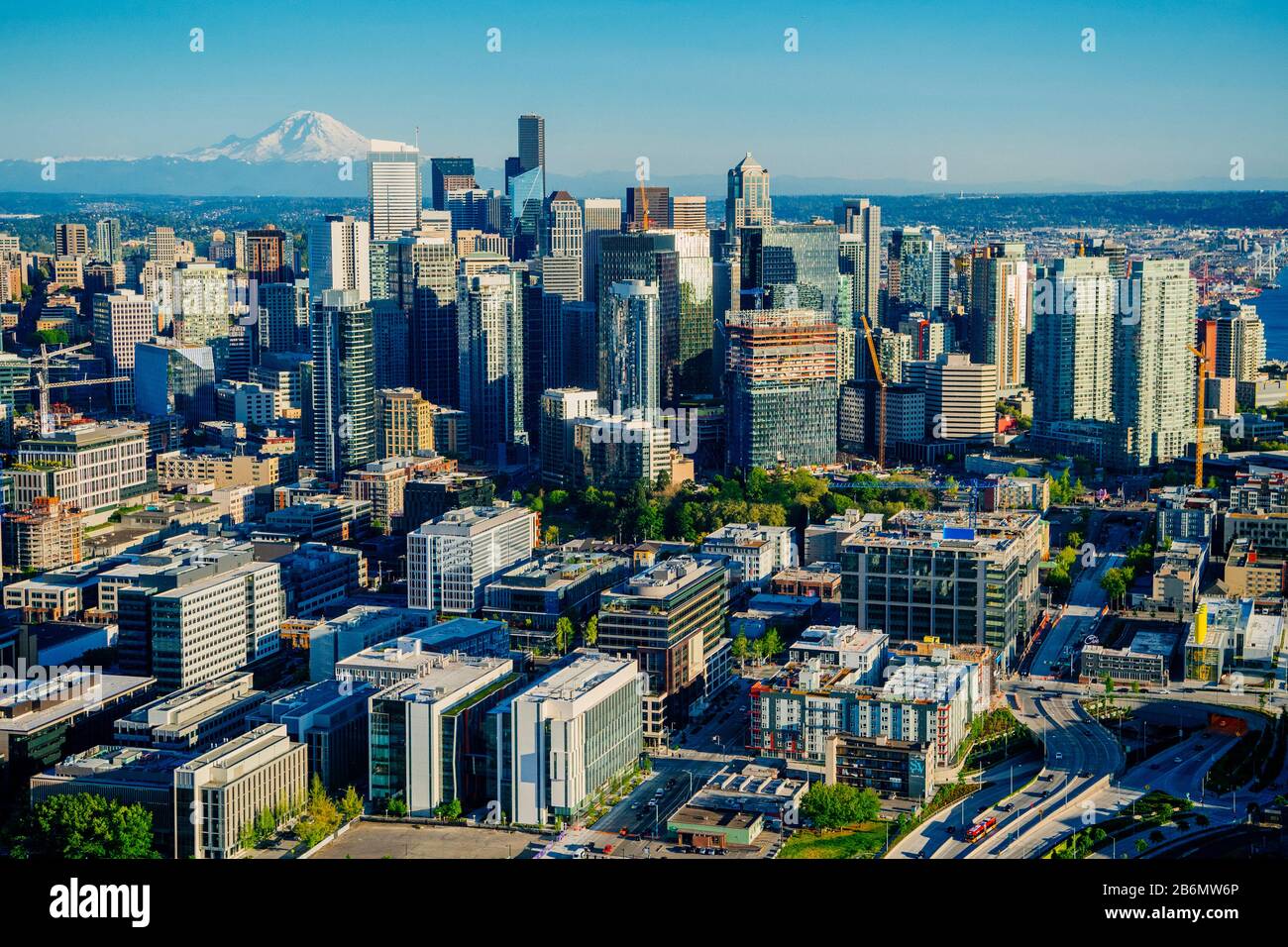 Aerial view of city of Seattle with Mount Rainier in background ...