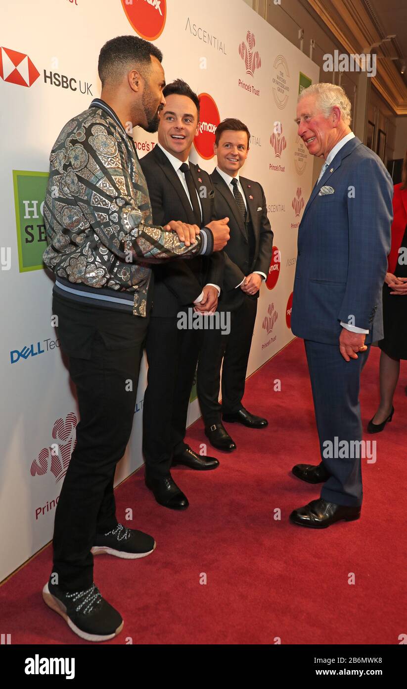 The Prince of Wales speaks with (left to right) singer Craig David and ...