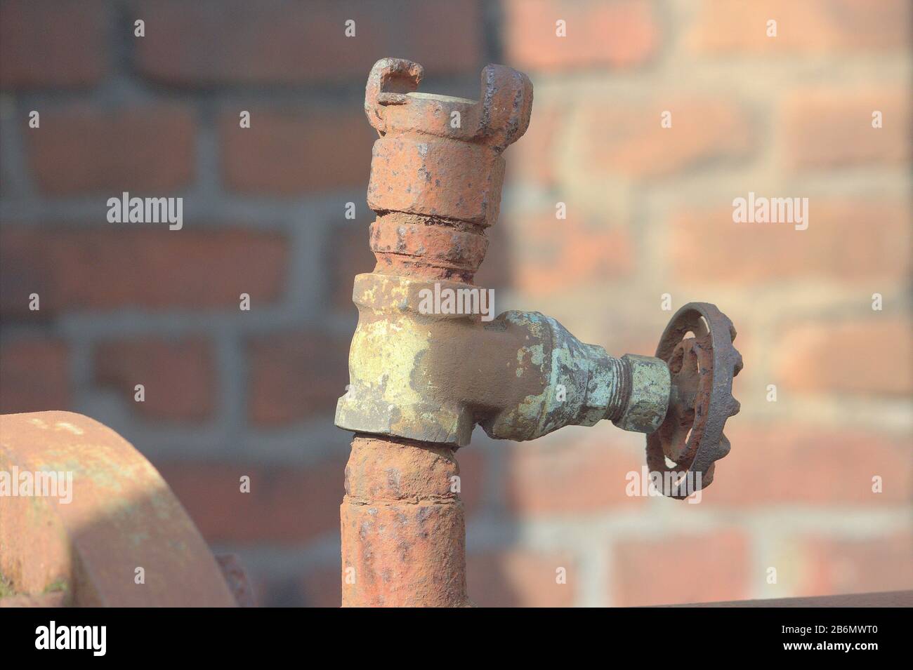 rusted iron pipe with shut-off valve in an old factory Stock Photo - Alamy