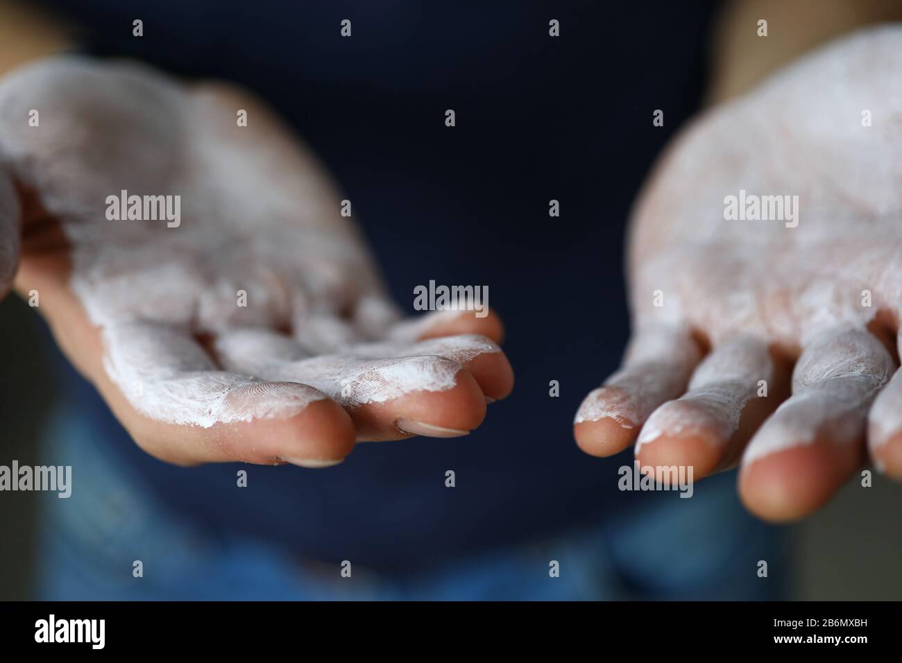 Male hands smeared with magnesium powder ready to workout Stock Photo ...