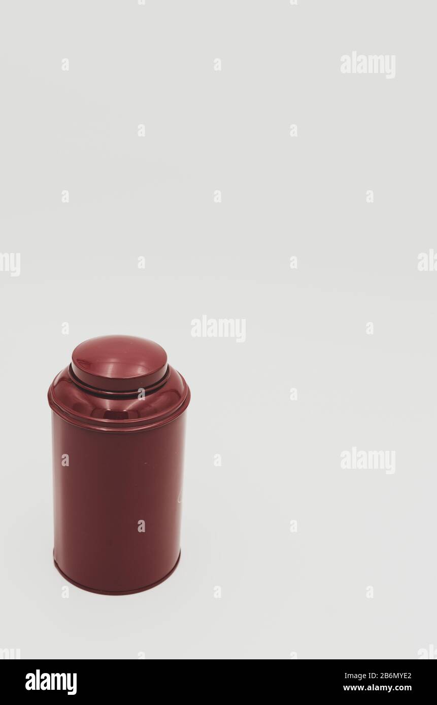 red metal can on a white surface Stock Photo - Alamy