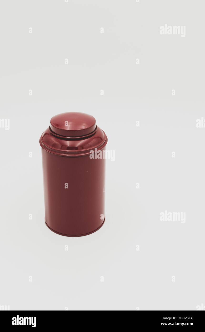 red metal can on a white surface Stock Photo - Alamy