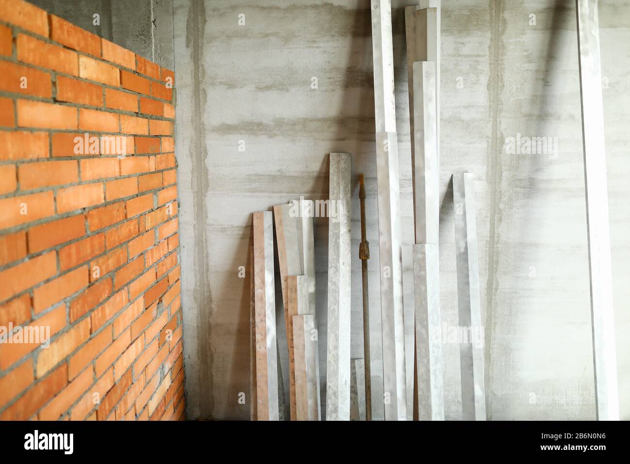 Set of finishing building tools standing at wall Stock Photo - Alamy
