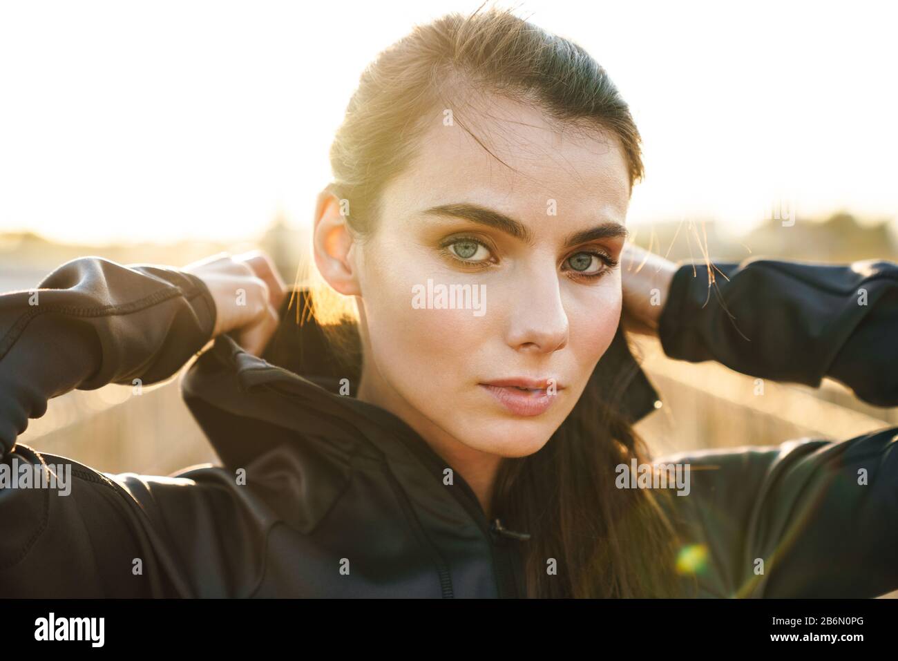 Image of a beautiful young amazing sports fitness woman posing outdoors ...