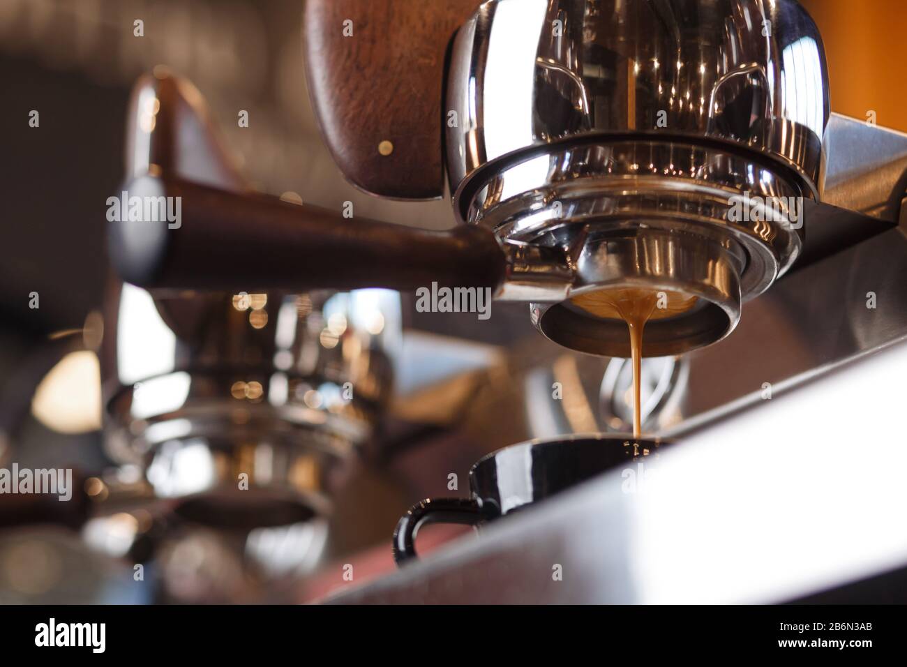 Coffee machine preparing fresh espresso through the bottomless ...