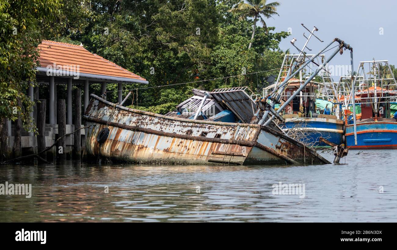 Sunken fishing trawler in the backwaters of Kerala, India Stock Photo ...