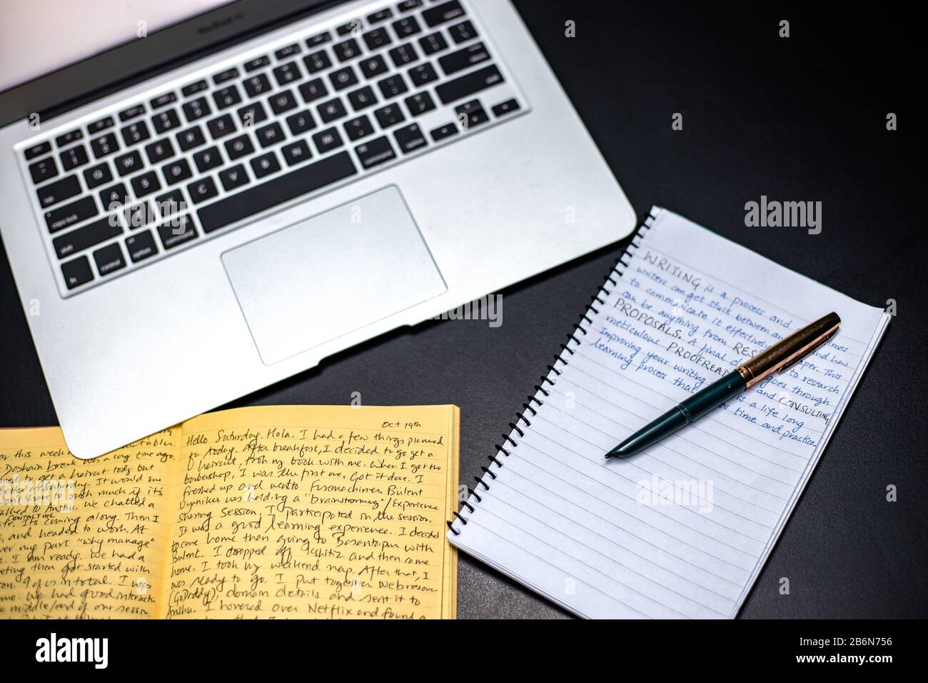 Taking Note Concept. Hand of a young businessman taking notes with a ...