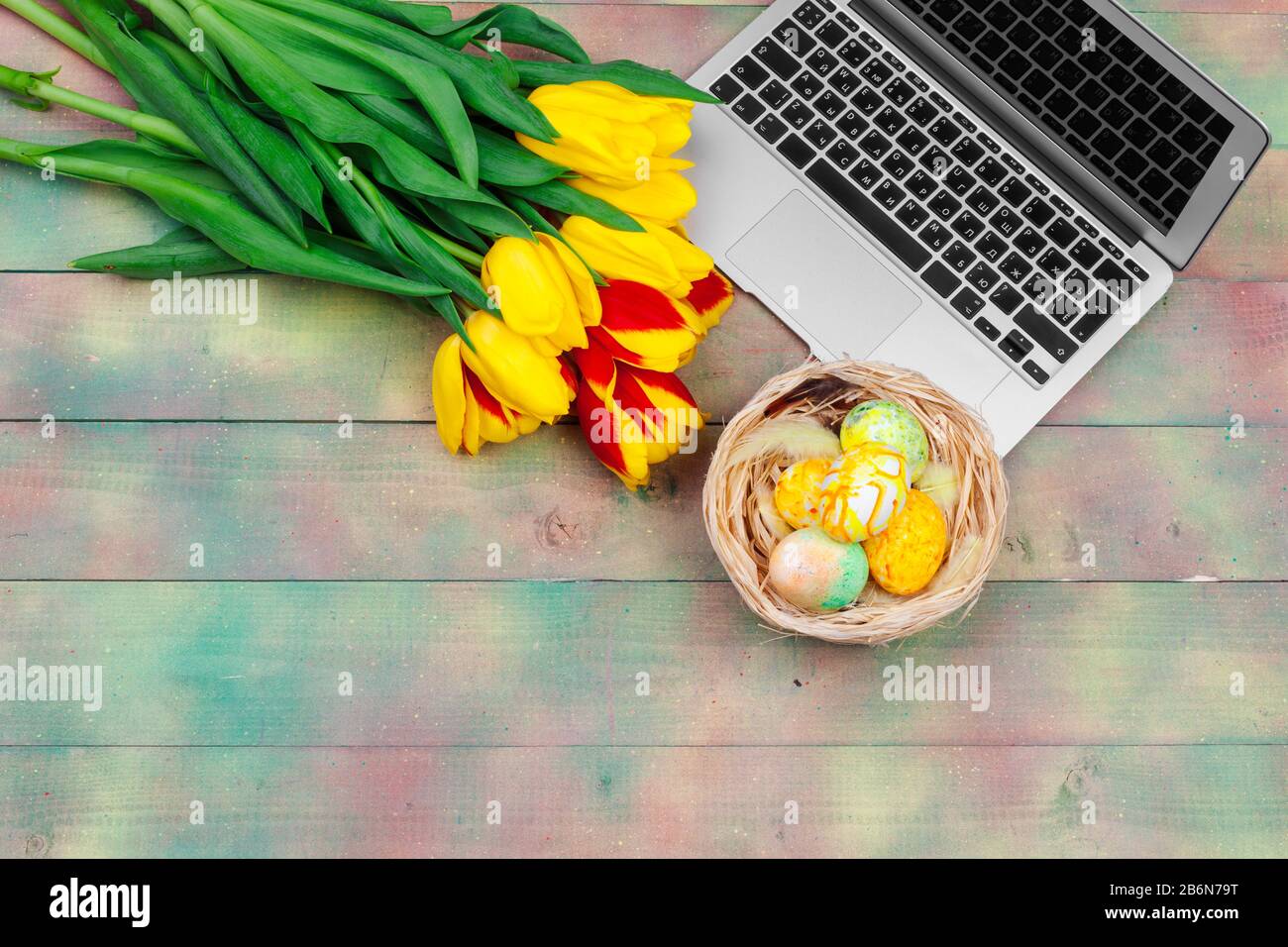 Easter eggs, mockup laptop and bouquet of tulips Stock Photo - Alamy