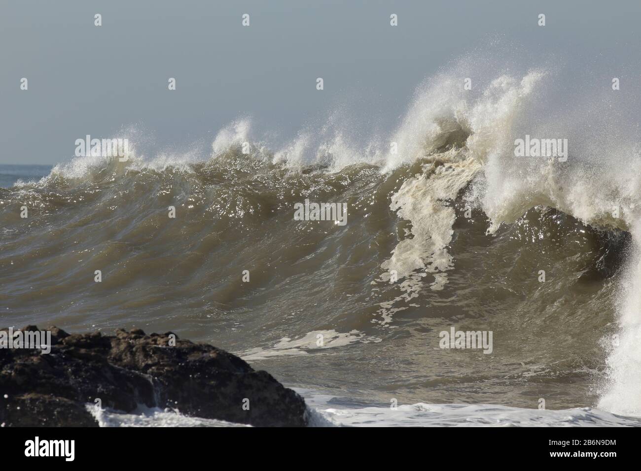 Beautiful huge breaking green wave Stock Photo - Alamy