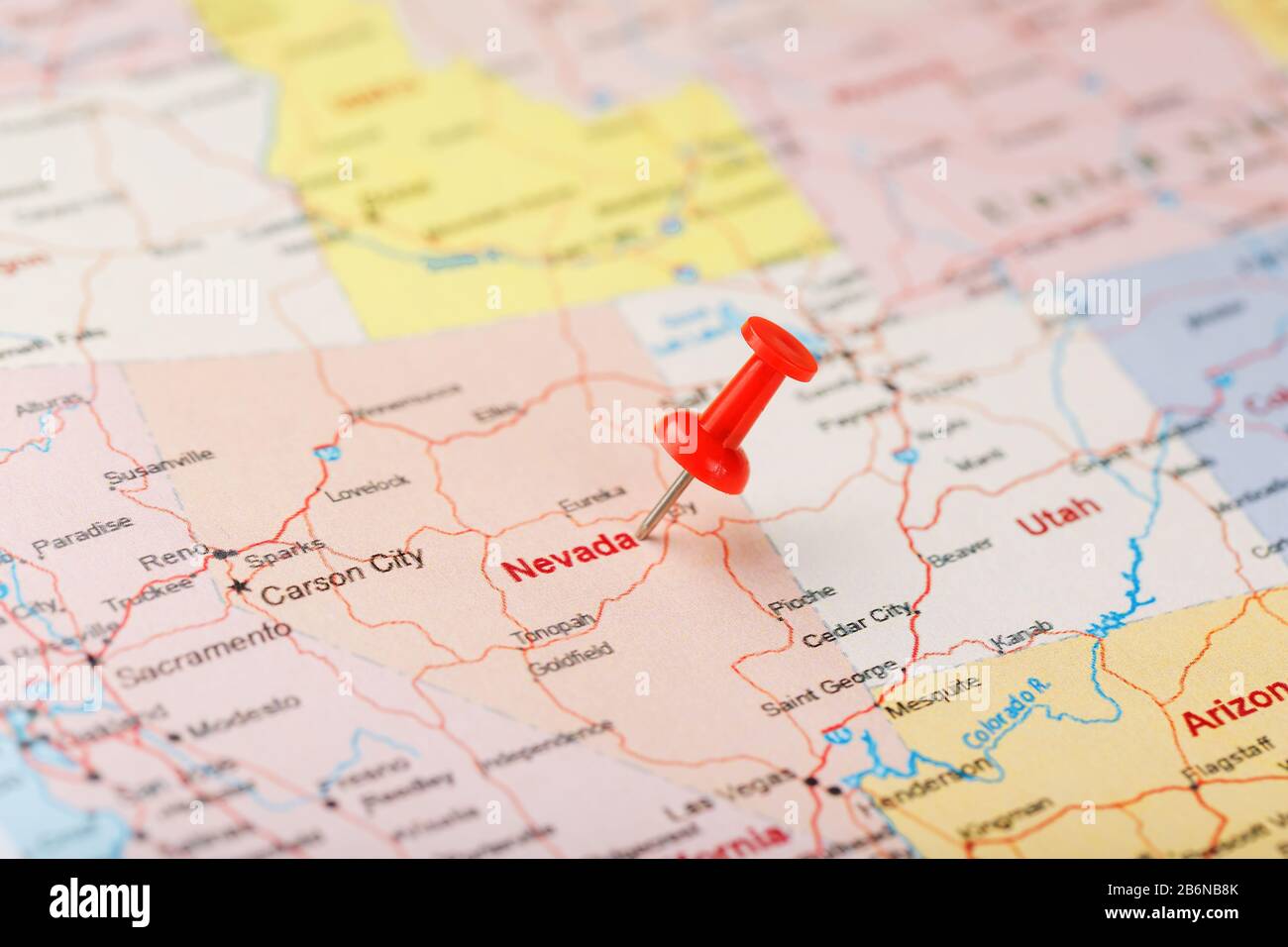 Red clerical needle on a map of USA, Nevada and the capital Carson City ...