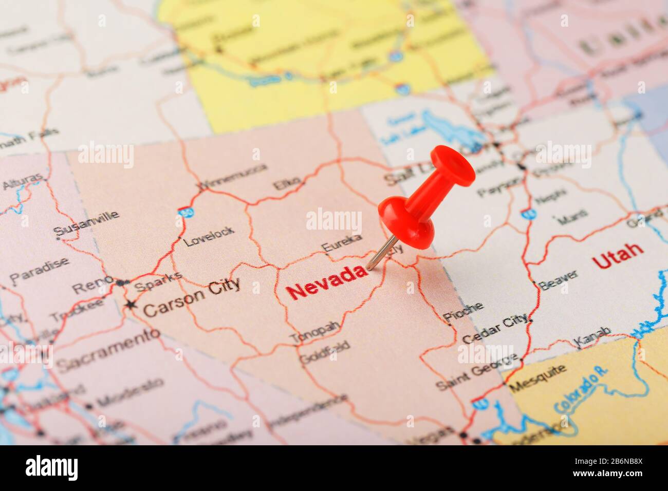 Red clerical needle on a map of USA, Nevada and the capital Carson City ...